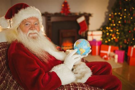 Santa Claus Holding Bag Of Presents And The Earth Stock Photo Image