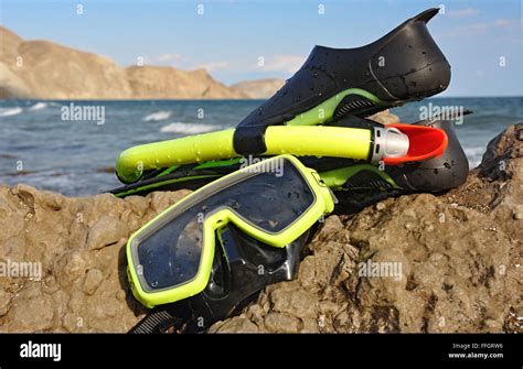 Flippers Snorkel And Diving Mask On Seacoast Stock Photo Alamy