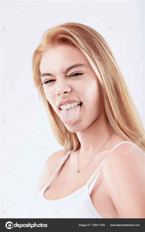 Young Blonde Woman Playfully Sticks Out Her Tongue Squints Her — Stock