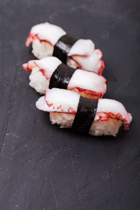 Close Up Of Tako Nigiri Sushi With Cooked Octopus On A Black Slate ...