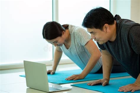 Two Asian Couple Husband Wife Practice Yoga Pose Cobra Or Bhujangasana