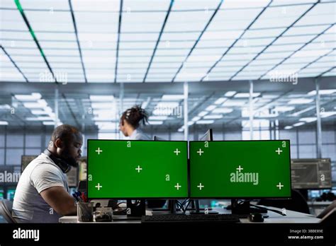 Data Center Employees Using Isolated Screen Multi Monitor Pc Setup To