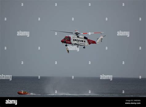 Uk Hm Coastguard Helicopter In Training Manoeuvres With Rnli Humber