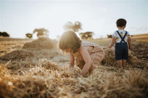 Premium Photo Brother And Sister Playing In The Fields