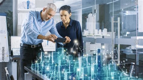 Male And Female Architects Work With Holographic Augmented Reality 3d