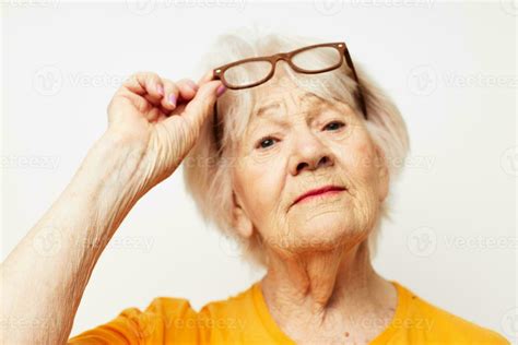 Photo Of Retired Old Lady In Casual T Shirt And Glasses Isolated