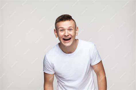 Premium Photo Young Success Man Looking At Camera And Toothy Smile