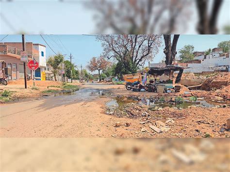 Drain Water Flowing In The Main Road Of The City It Is Difficult For