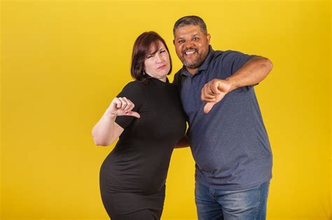 Premium Photo Brazilian Couple Caucasian Woman And Black Man Thumbs
