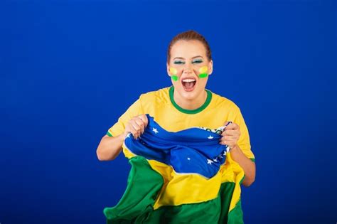 Premium Photo Caucasian Woman Redhead Brazil Soccer Fan Brazilian Blue Background Screaming