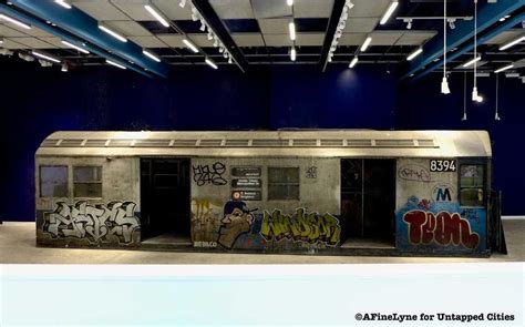 An Abandoned Graffitied Nyc Subway Car Is Inside An Empty 42nd Street