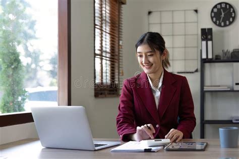 Businessman Hands Using Text Information On Laptop To Analyze Financial