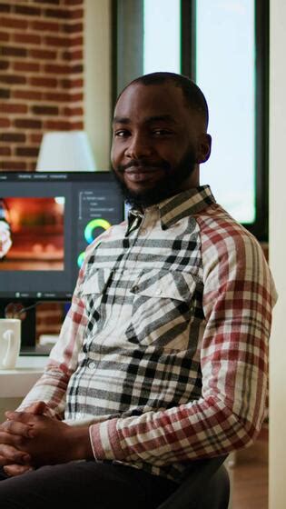 Vertical African American Male Filmmaker Works With Creative Editing Software Mixing And Color