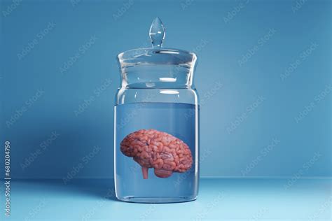 Human Brain In A Jar Of Preserving Solutions On Blue Background Illustration Of The Concept Of