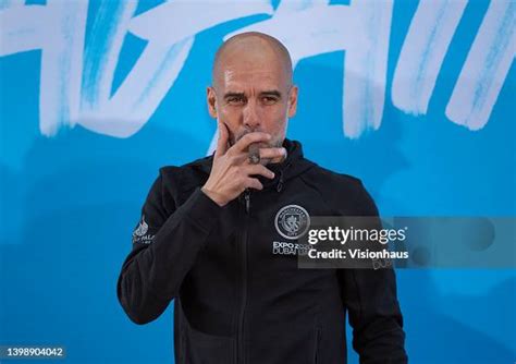 Manchester City Manager Pep Guardiola Smoking A Cigar During The