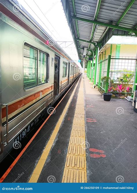 The Train Stopped At The Station Waiting For A Signal To Continue On