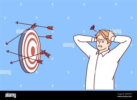 Discouraged Man Clutching Head Standing Near Darts Board After Failed