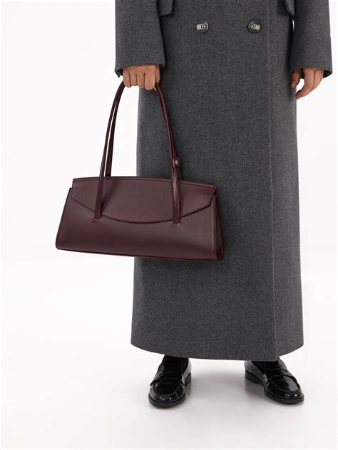 Сумка із натуральної шкіри винного кольору купити з доставкою по Україні ціни відгуки фото