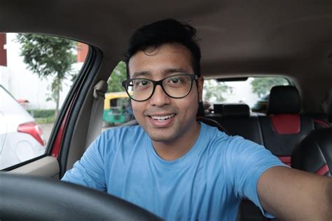 Premium Photo Indian Male Smiling While Taking A Selfie In The Car