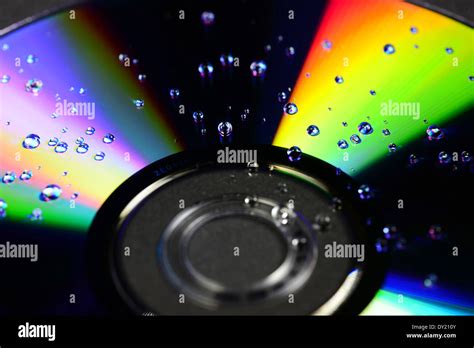 compact disc with water drops isolated on black background Stock Photo ...