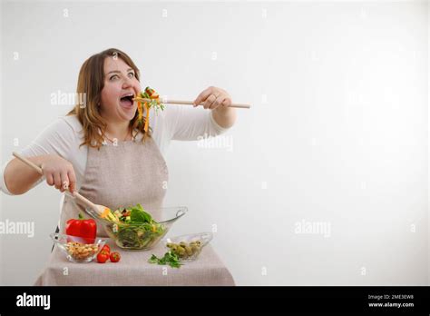 Funny Cheerful Woman Eating Salad On White Background She Opens Mouth