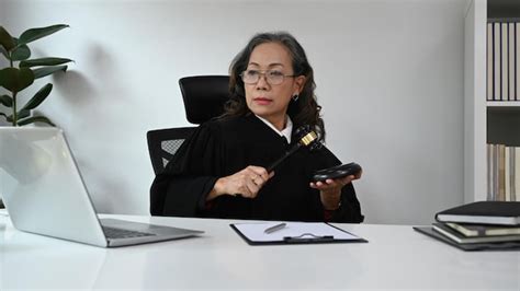Premium Photo Mature Woman In Robe Gown Uniform Having Video