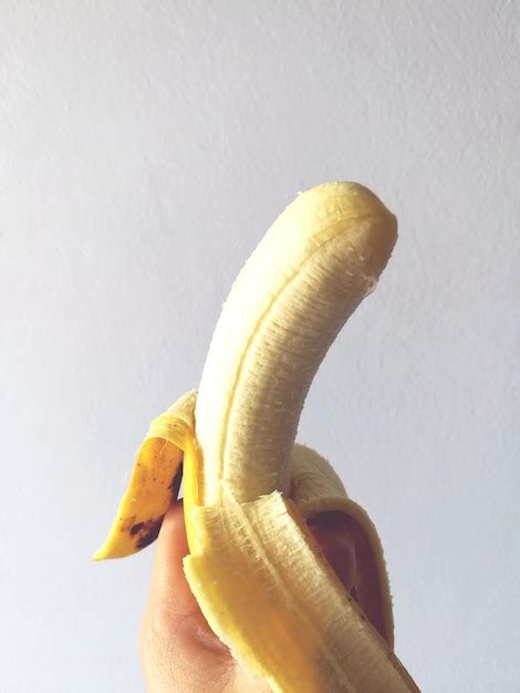 Close Up Of Hand Holding Fruit Premium Ai Generated Image