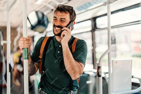 Premium Photo Portrait Of A Happy Young Man Standing In A City Bus