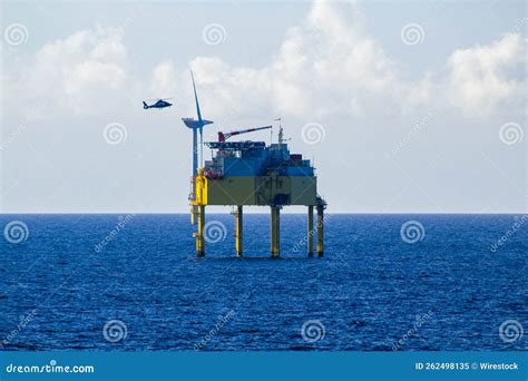 Helicopter Approaching A Transformer Platform At An Offshore Wind Farm