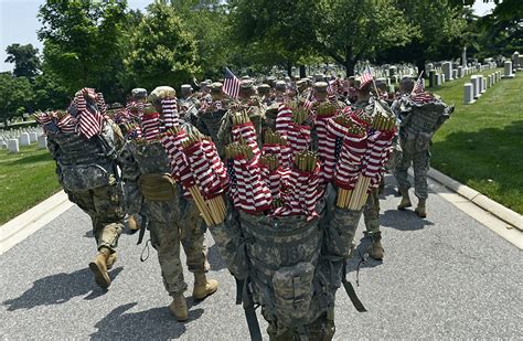 Here Are 11 Photos Of Soldiers Placing Flags At Arlington National