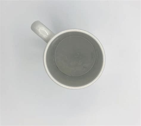 Ancienne chope à bière en grès émaillé blanc
