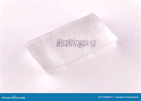 Optical Birefringence Demonstrated Using A Text Using A Natural Double Spar Calcite Crystal