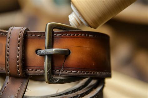 Premium Photo Craftsperson Applying Leather Conditioner To A Finished