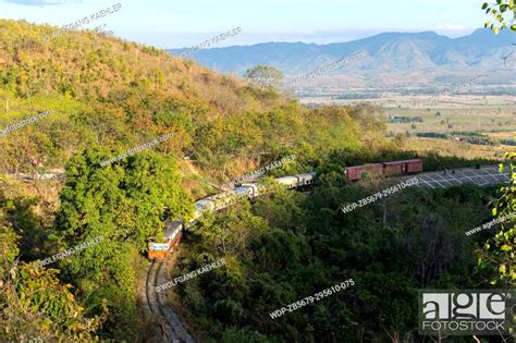 A Train Is Climbing Up A Mountain Along The Road Between Heho And Inle