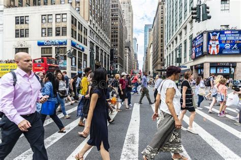 People Going Through A Pedestrian Crossing In New York City Usa