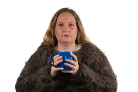 Premium Photo Portrait Of Woman Wearing Sweater Holding Cup Against