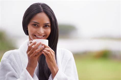 Premium Photo Enjoying Her Morning Cup Of Coffee A Beautiful Young
