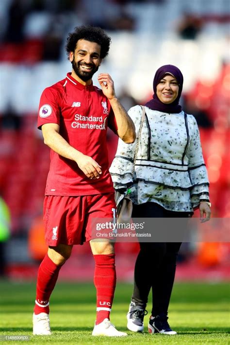 Mohamed Salah Of Liverpool And His Wife Magi Walk On The Pitch After