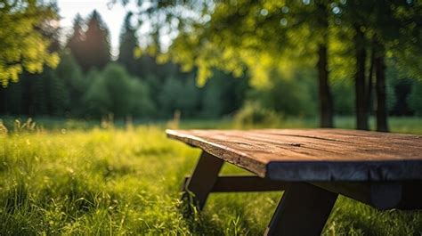 Premium Ai Image A Wooden Table In A Grassy Area