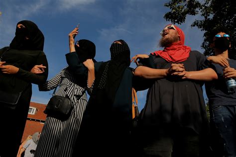 A Denmark Cop Hugged A Burqa Clad Woman While She Was Protesting Face