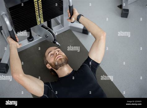 Man Doing Exercise On Decompression Simulator At Rehabilitation Center