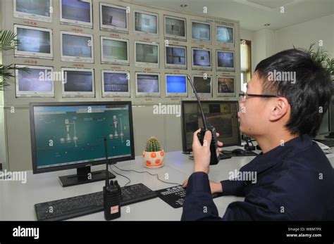 File A Chinese Worker Monitors The Production Of Cement In The