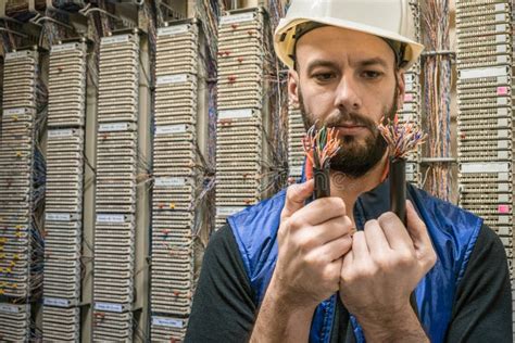 Worker Restores The Connection In The Data Center Server Room Engineer
