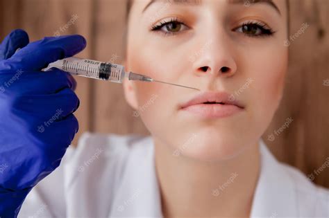 Premium Photo Doctor In Gloves Giving Woman Botox Injections In Lips