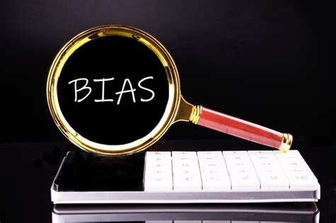 Premium Photo Bias A Word Through A Magnifying Glass On A Calculator