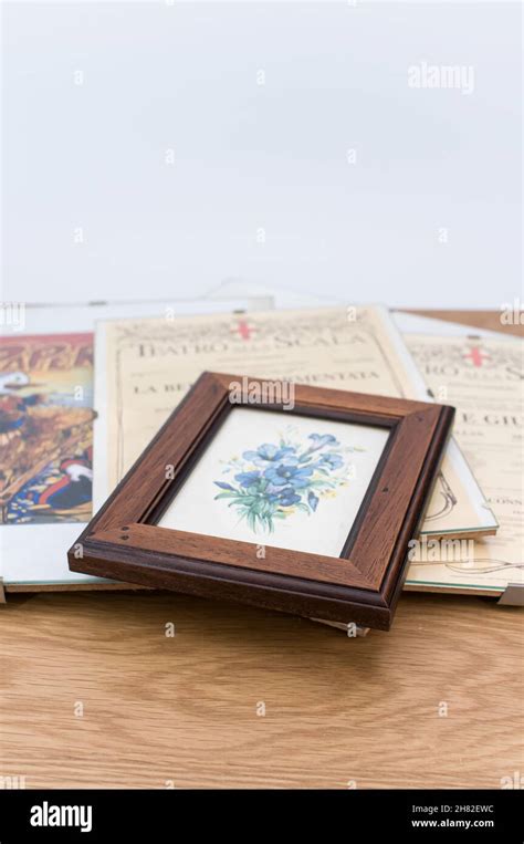 Glass Clip Frames With Posters On A Wooden Tabletop Background Stock