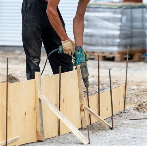A Worker Installs Formwork On The Foundation Stock Image Image Of