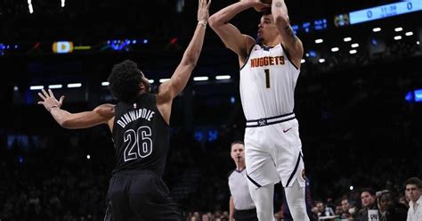 Murray Jokic Help Defending Champion Nuggets Outlast Nets 122 117