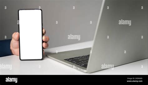 Close Up Businessman Holding Smartphone With Blank Mock Up Screen In
