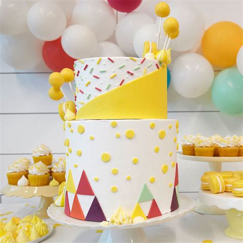 Yellow Bright Two Tiered Triangle Cake Wilton